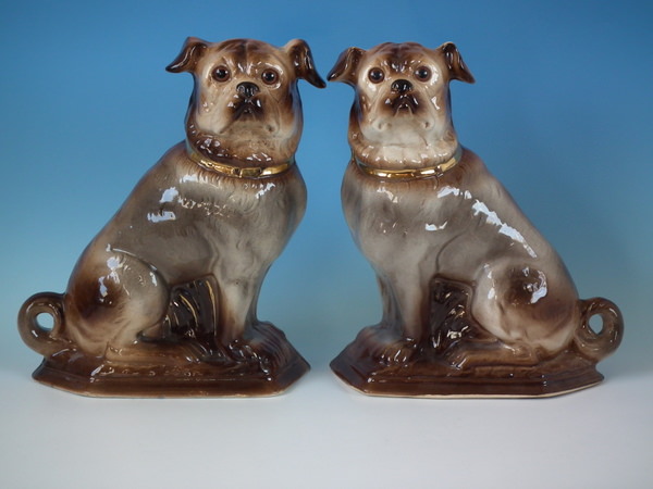 Pair Staffordshire pugs with glass eyes